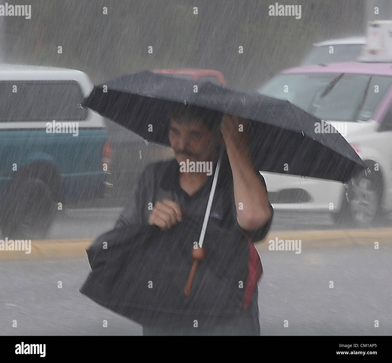 Man dry rain all around hi-res stock photography and images - Alamy