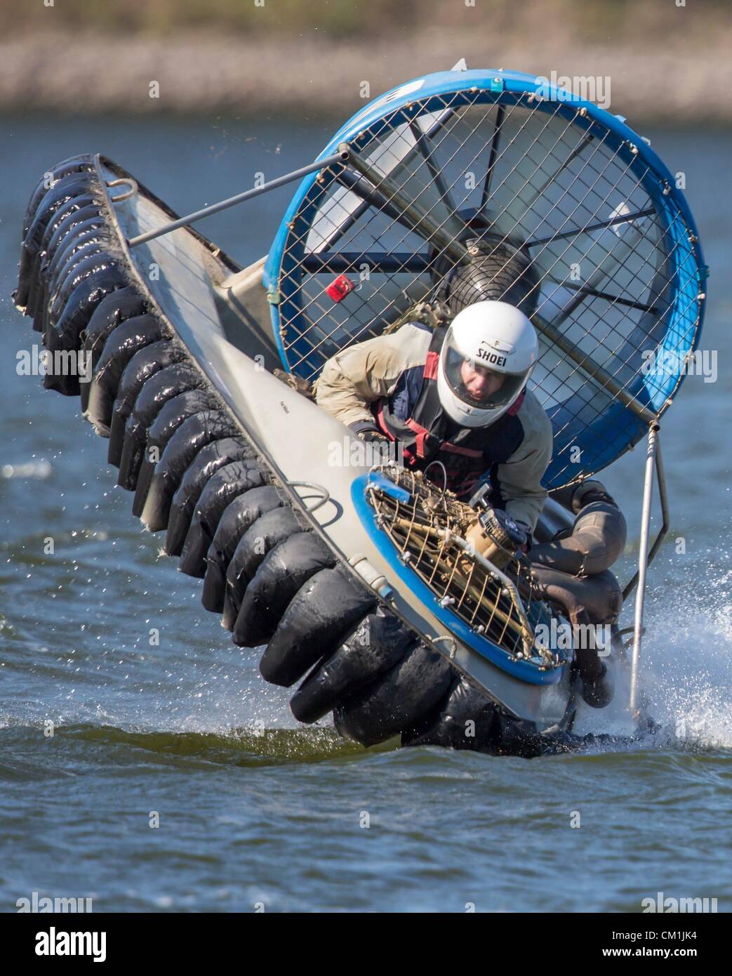 14.09.2012. Saalburg, Germany. A hovercraft driver lifts up on the race ...
