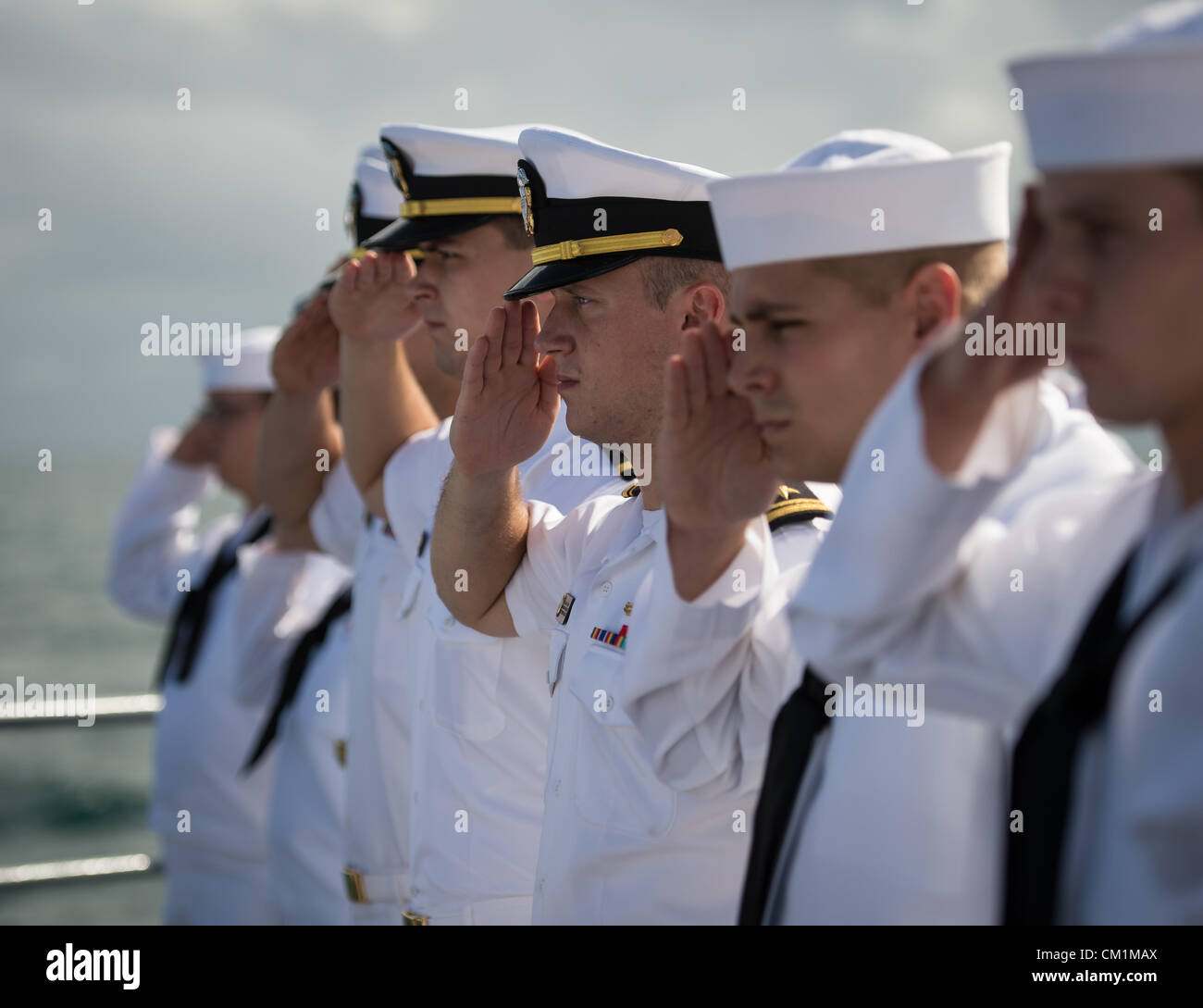 Members of the US Navy salute in honor of Apollo 11 astronaut Neil ...