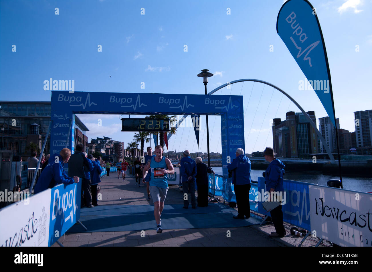 Runners crossing the finish line in the inaugural BUPA Great North 5K ...