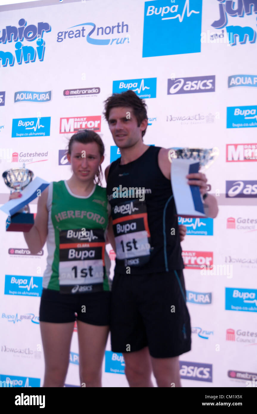 Winners Chris Parr and Clara Evans standing on the podium after being ...