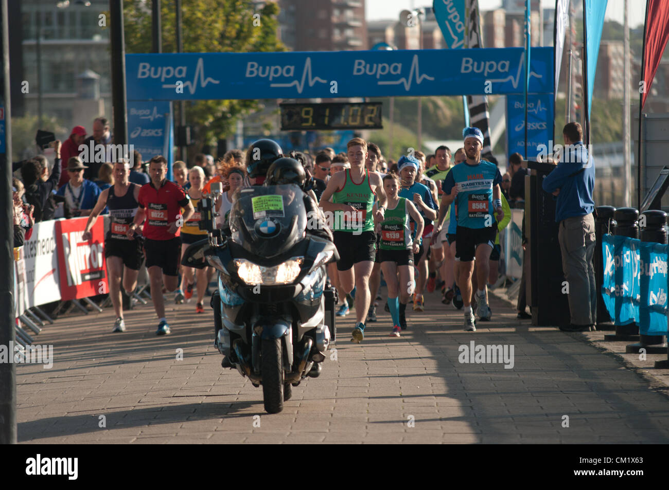 Athletes turning the first corner at the start of the inaugural BUPA ...