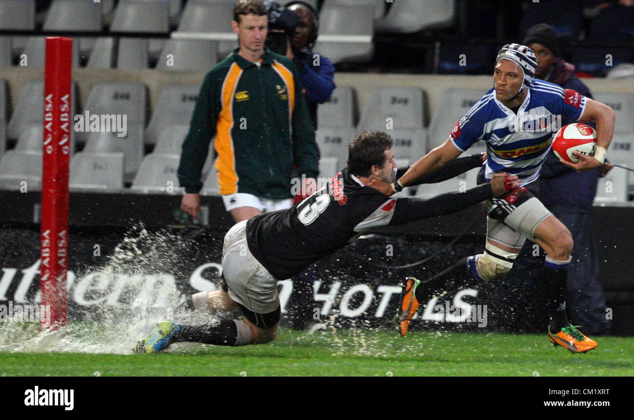 DURBAN, SOUTH AFRICA - SEPTEMBER 15, Gio Aplon hands off Tim Whithead ...