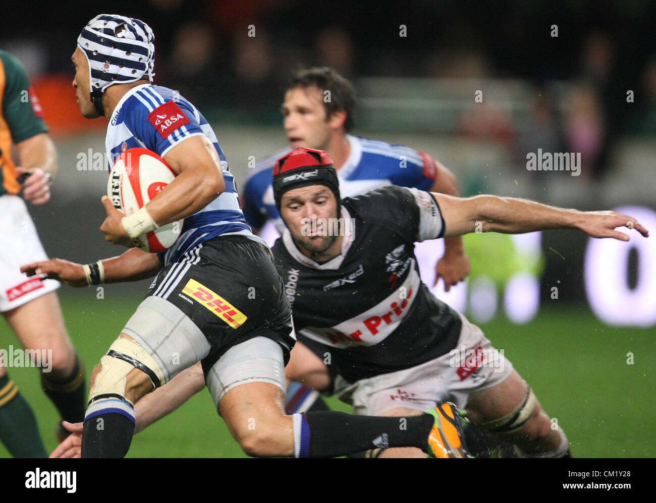 DURBAN, SOUTH AFRICA - SEPTEMBER 15, Jacques Botes looks to tackle Gio ...