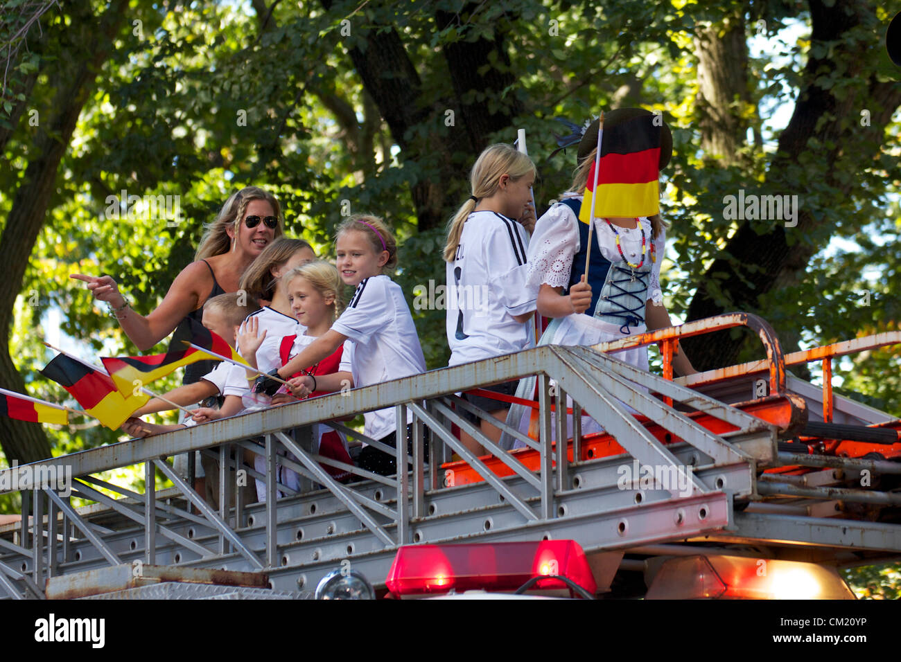New York, NY - September 15, 2012: Visiting German children riding atop ...