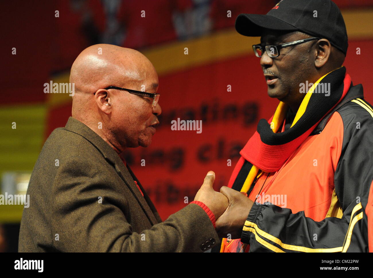 MIDRAND, SOUTH AFRICA: President Jacob Zuma holds hands with Cosatu ...