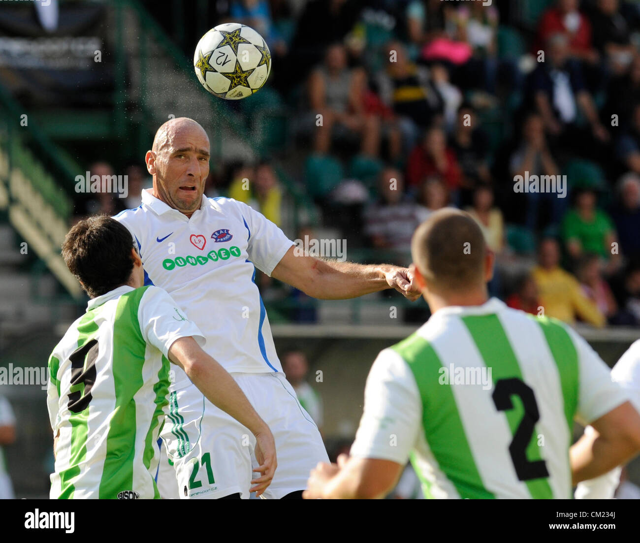 Former Czech soccer player Jan Koller (second from left) plays ball ...