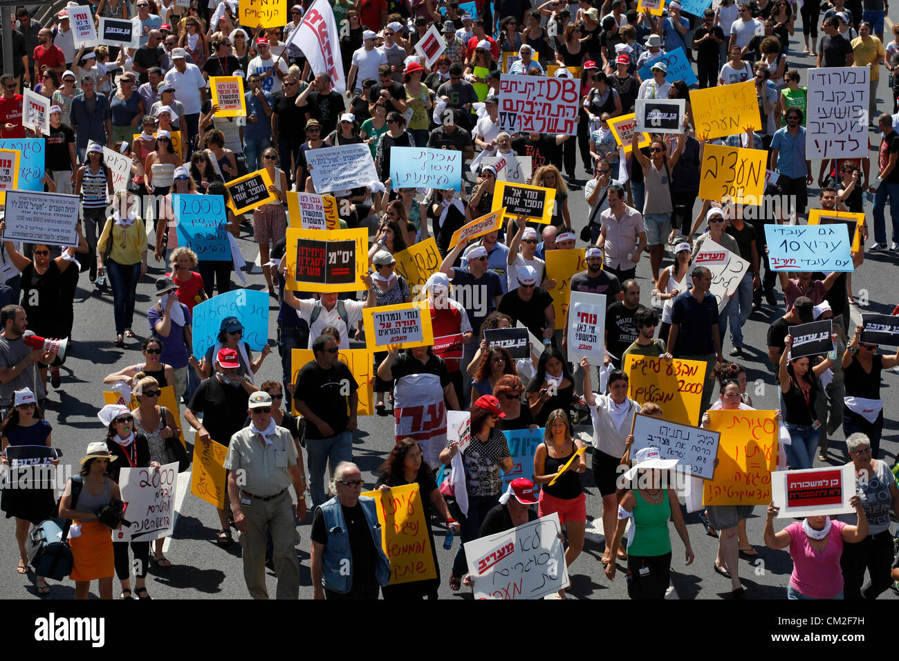 Israel daily Maariv newspaper employees and their supporters hld signs ...