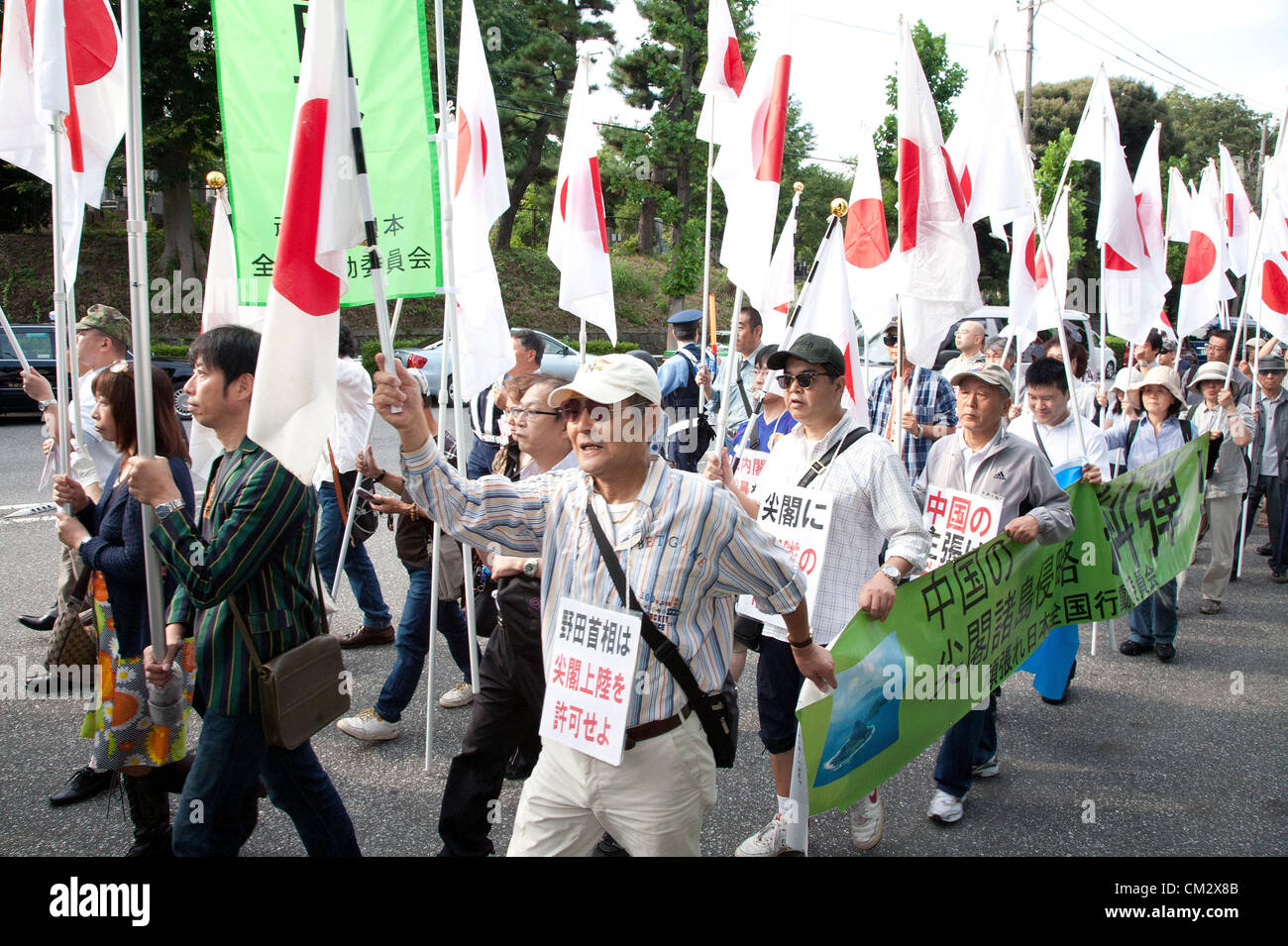 September 22, 2012, Tokyo, Japan - Protesters hold Japanese flags and ...