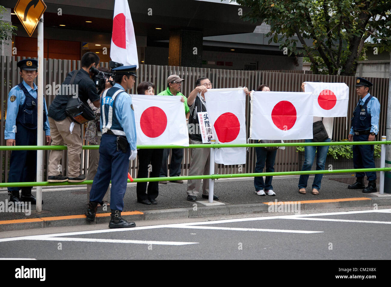 September 22, 2012, Tokyo, Japan - Protesters hold up Japan flags in ...
