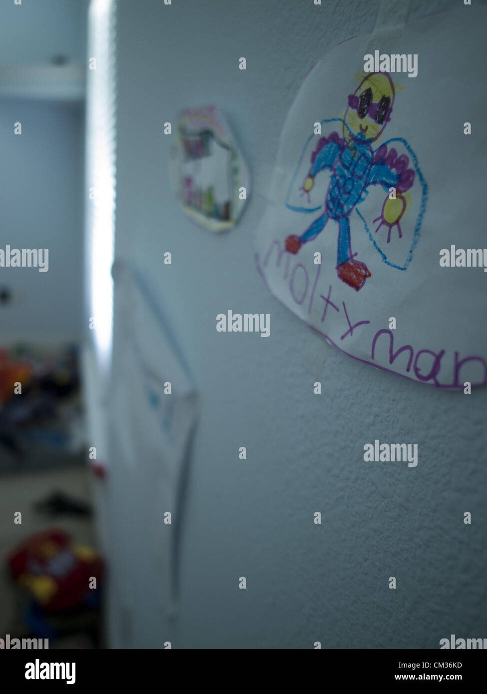 Child taped to wall hi-res stock photography and images - Alamy