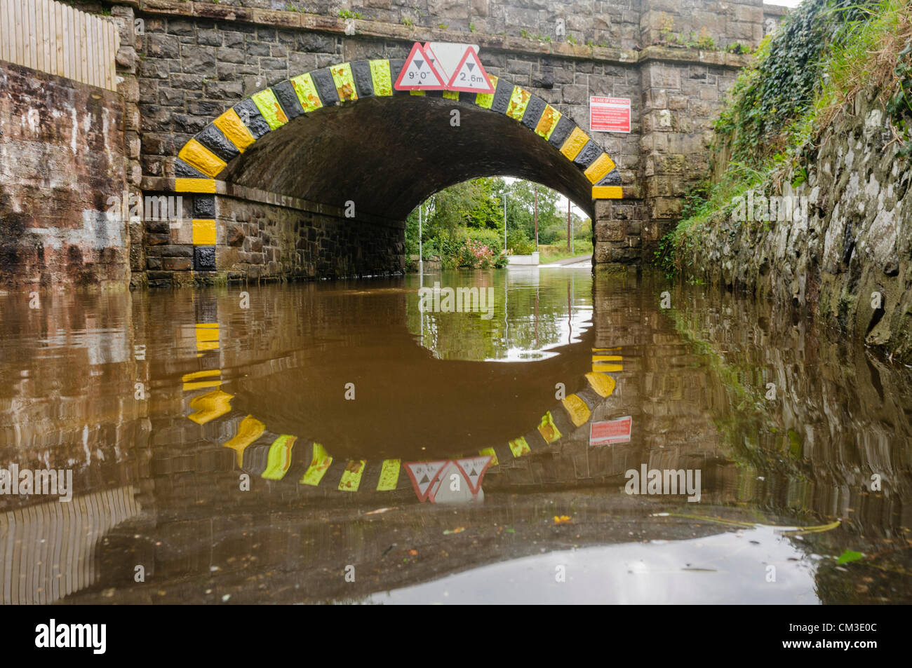 Flooded road underneath a bridge after a short period of very heavy ...