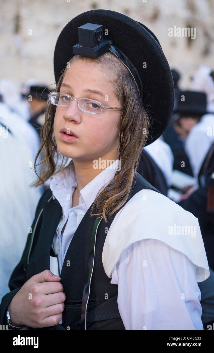 Jewish young man prays during the penitential prayers the Selichot ...