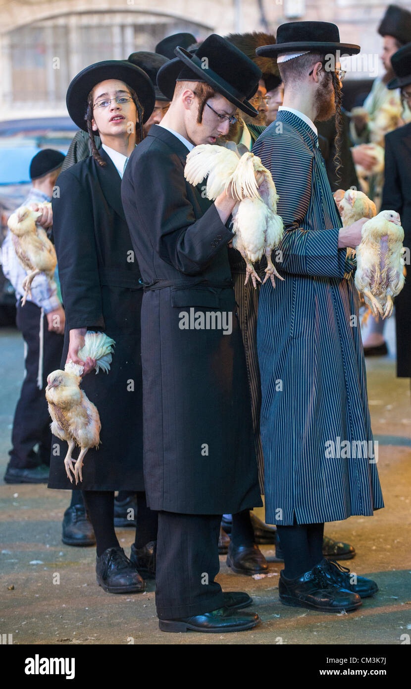 An ultra Orthodox Jewish man holds chicken during the Kaparot ceremony ...