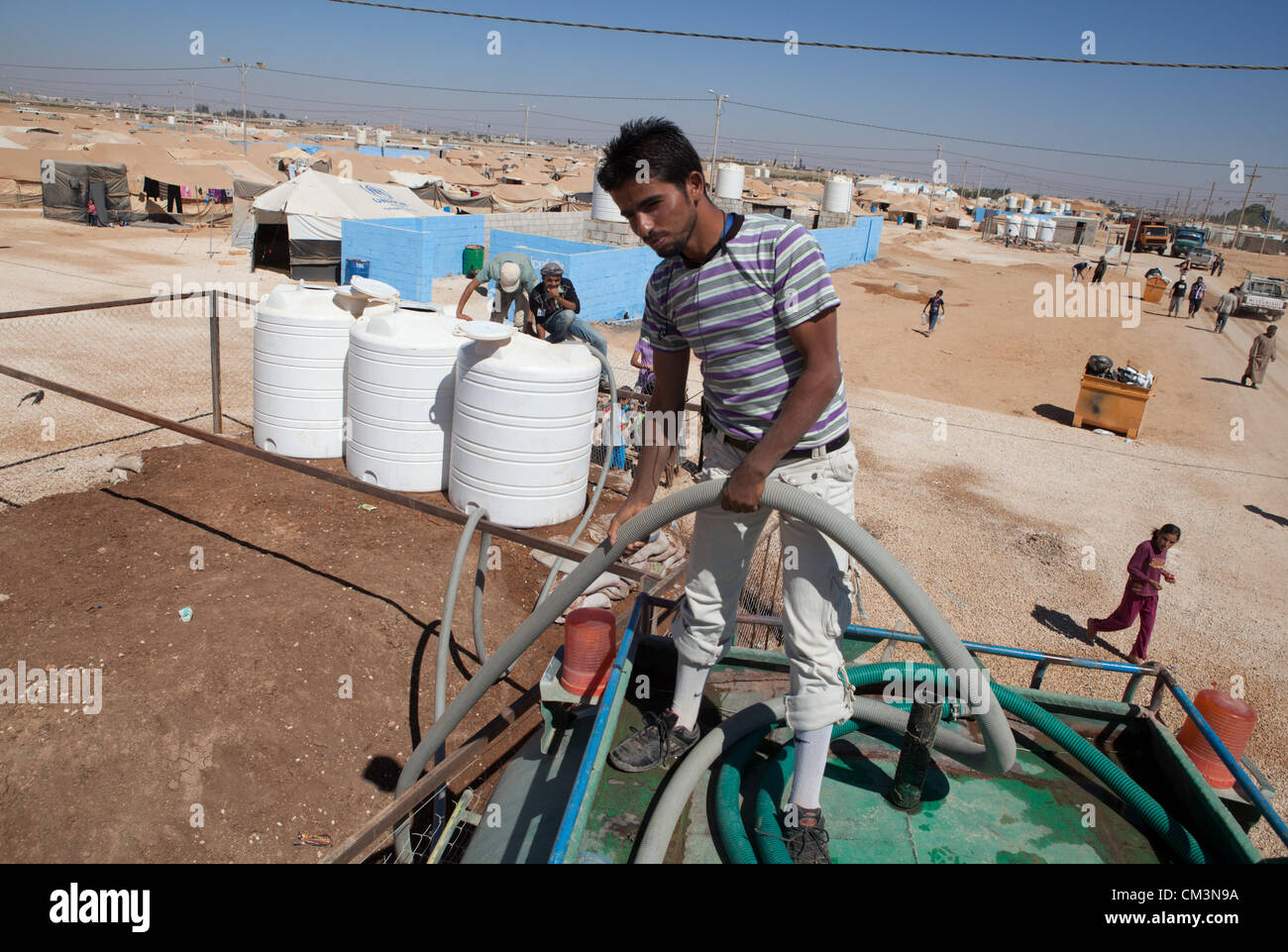 Man pumps water from water hi-res stock photography and images - Alamy