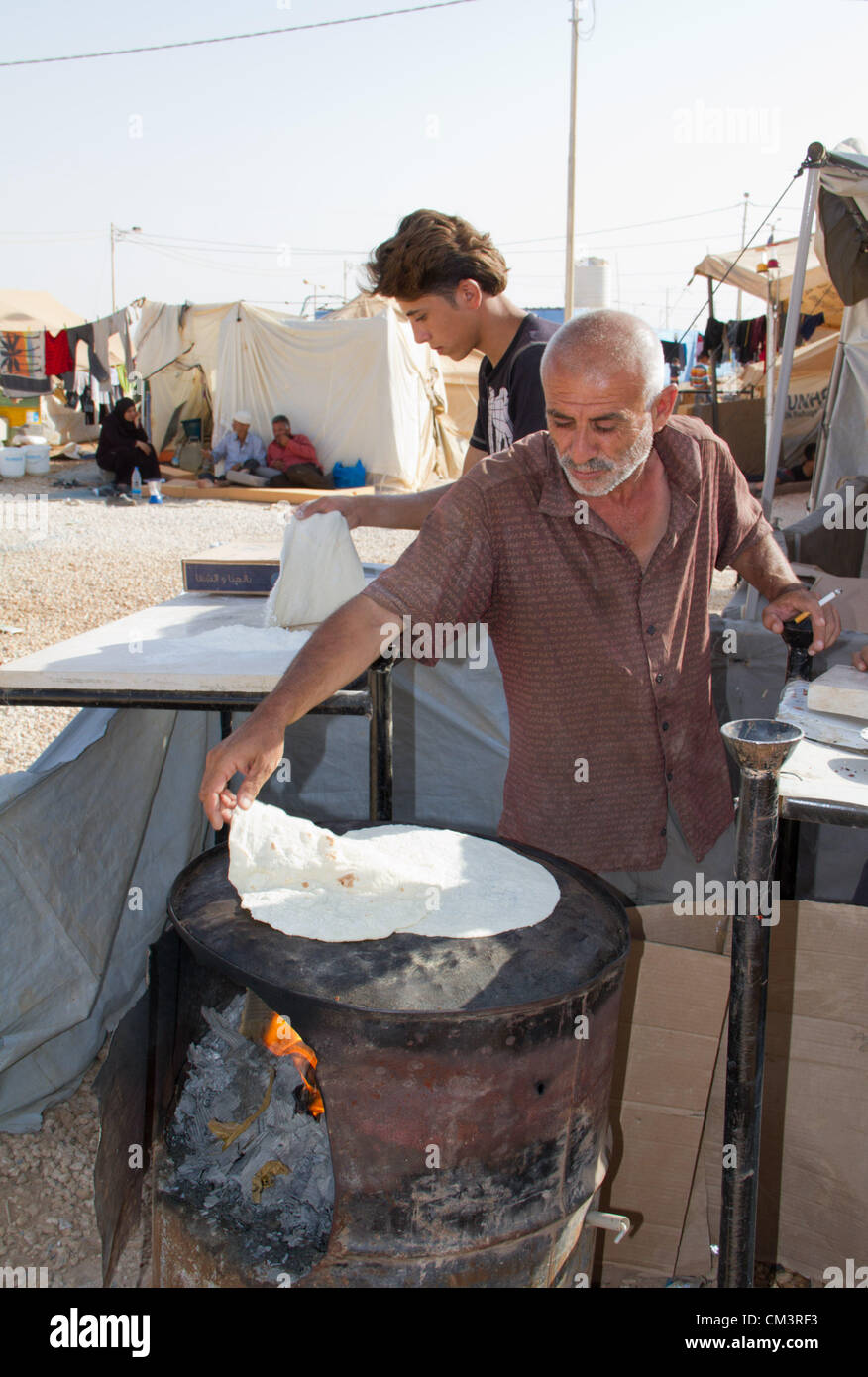 Men prepare bread at the Zaatari Refugee Camp in Jordan on Thursday ...