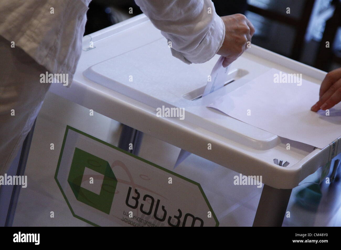 1 October 2012 - Tibilisi, Georgia - Voter slipping the envelope with ...