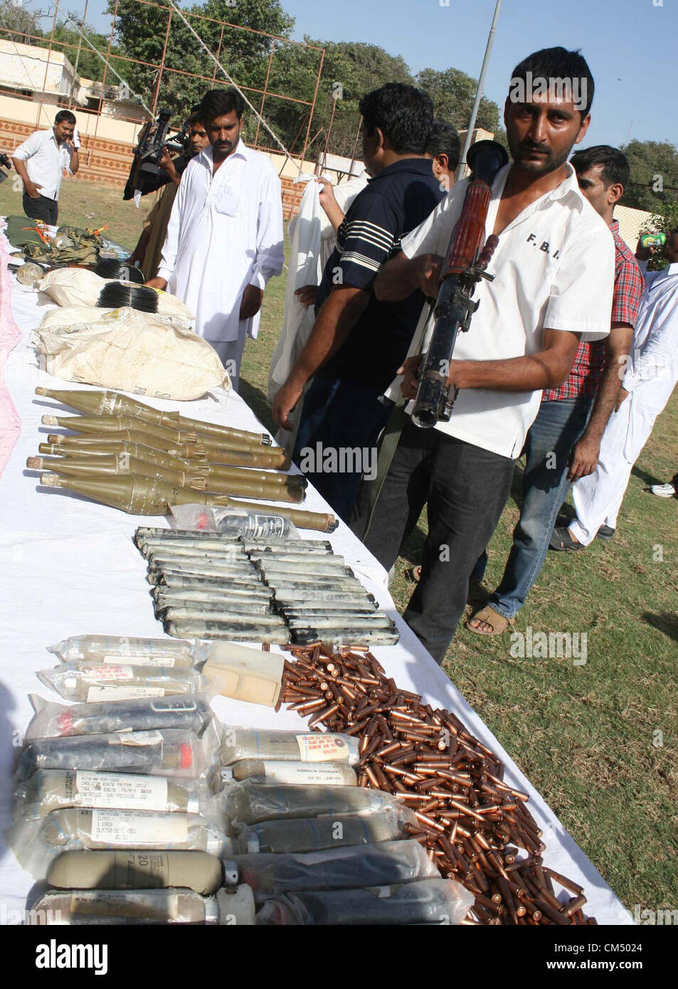 CID police officials inspect seized weapons, bullets and explosive ...