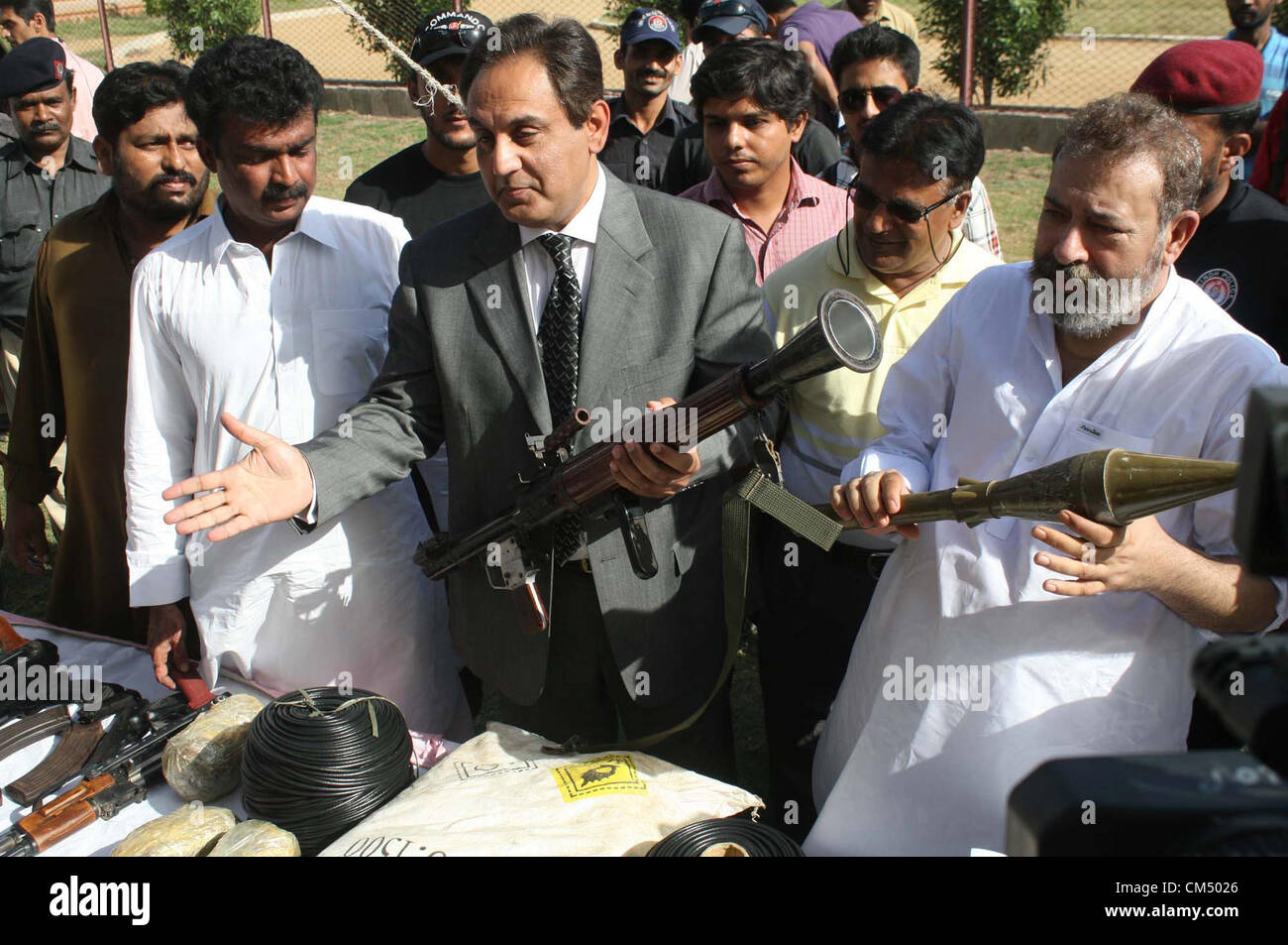 CID police officials inspect seized weapons, bullets and explosive ...