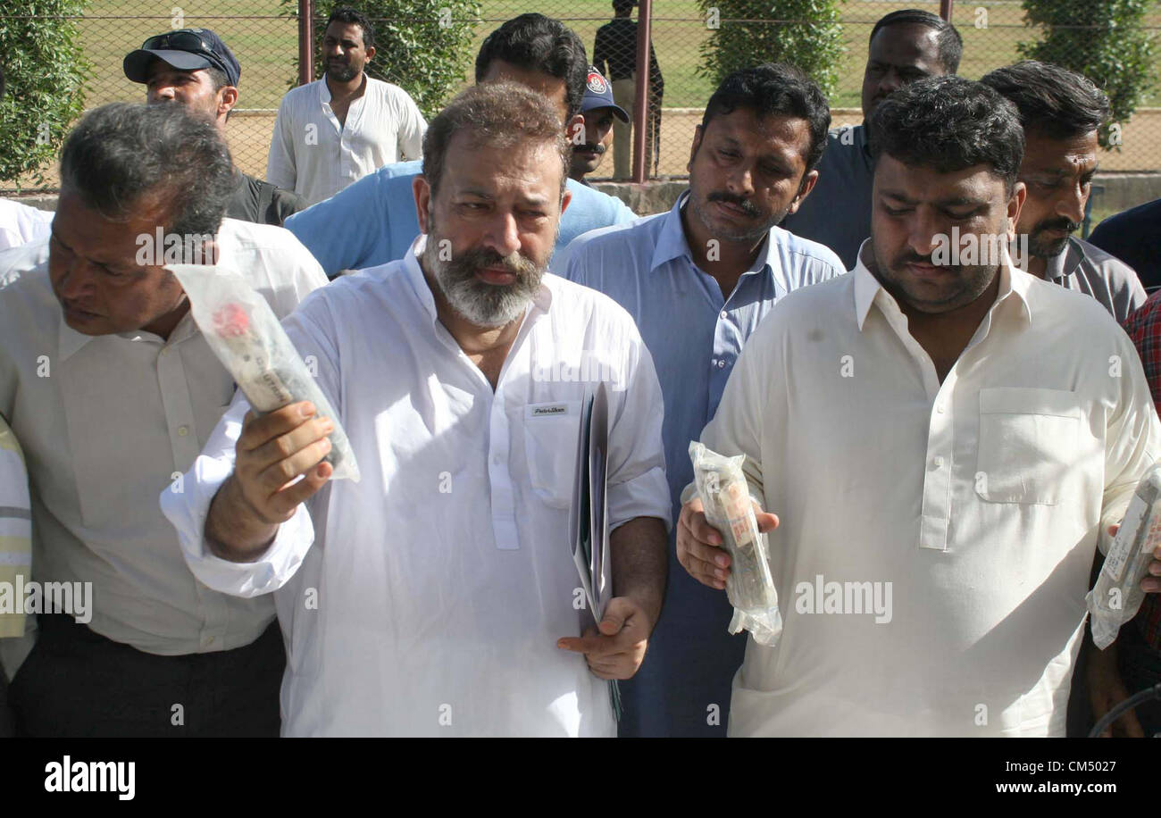 CID police officials inspect seized weapons, bullets and explosive ...
