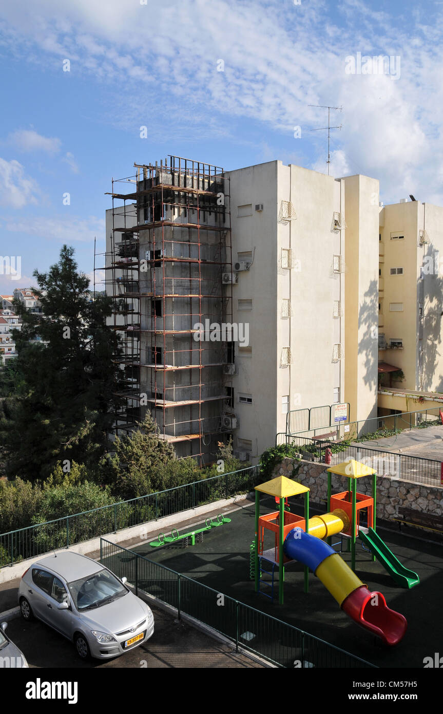 Construction of bomb shelter on a building in the Northern Israeli town ...