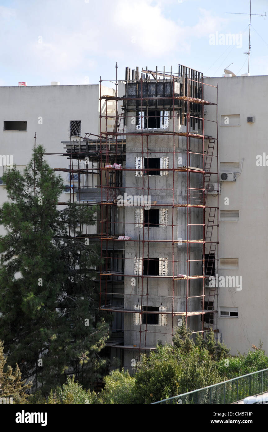 Construction of bomb shelter on a building in the Northern Israeli town ...