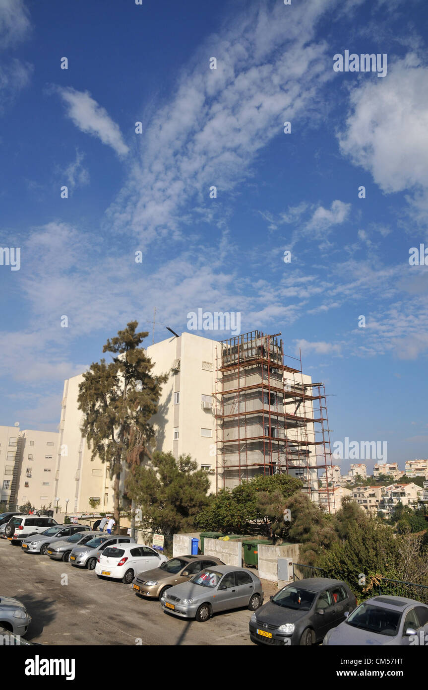 Construction of bomb shelter on a building in the Northern Israeli town ...