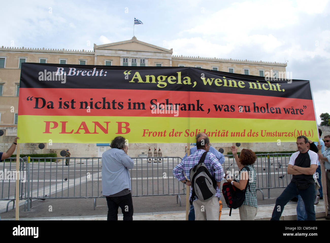 A banner against Chancellor Angela Merkel, outside the Greek parliament ...