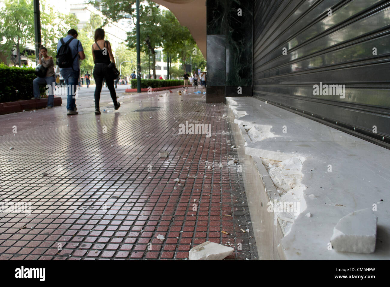 Smashed pavement during riots in Athens Stock Photo - Alamy