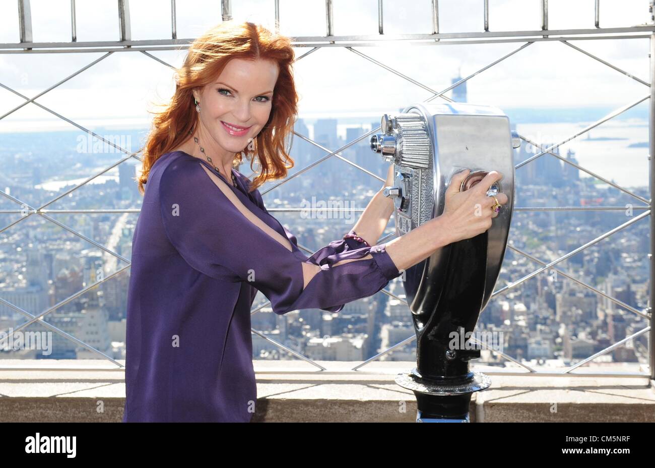 Oct. 10, 2012 - Manhattan, New York, U.S. - Actress MARCIA CROSS lights ...