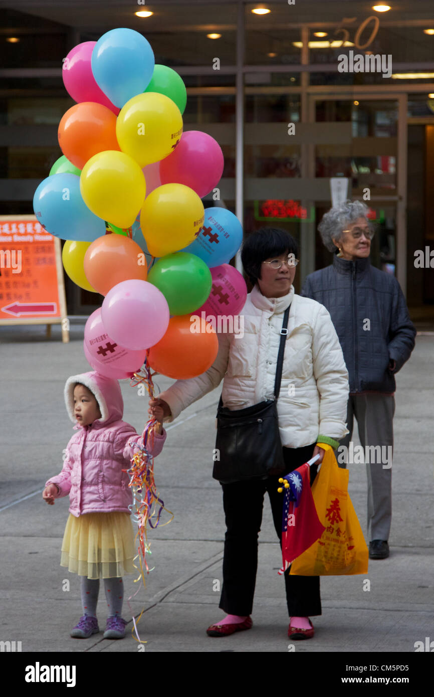 New York, NY, USA - October 10, 2012: Mother and Daughter watch the Taiwanese National Day ...