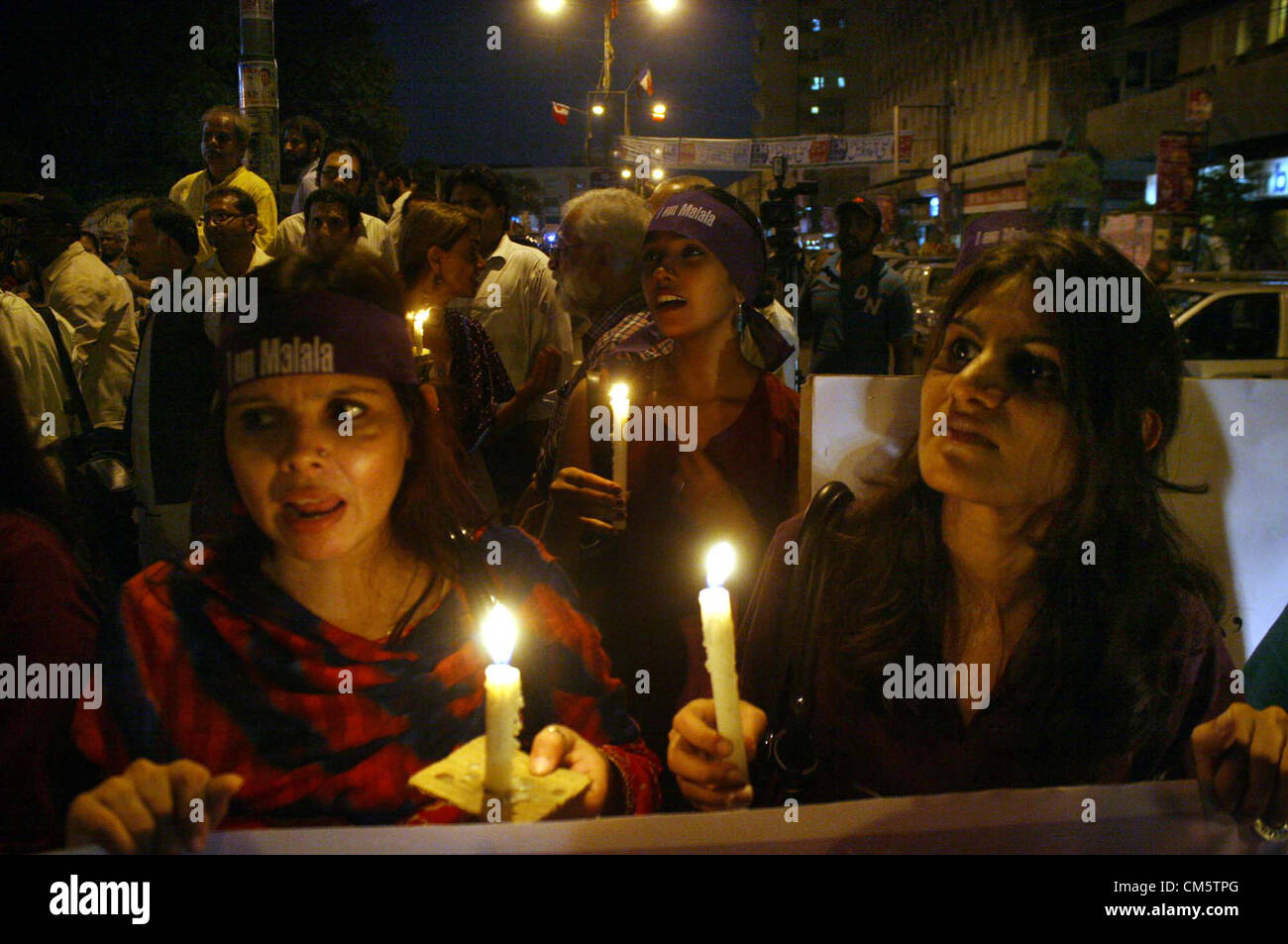Members of Aurat Foundation lighten candles and praying for Malala ...