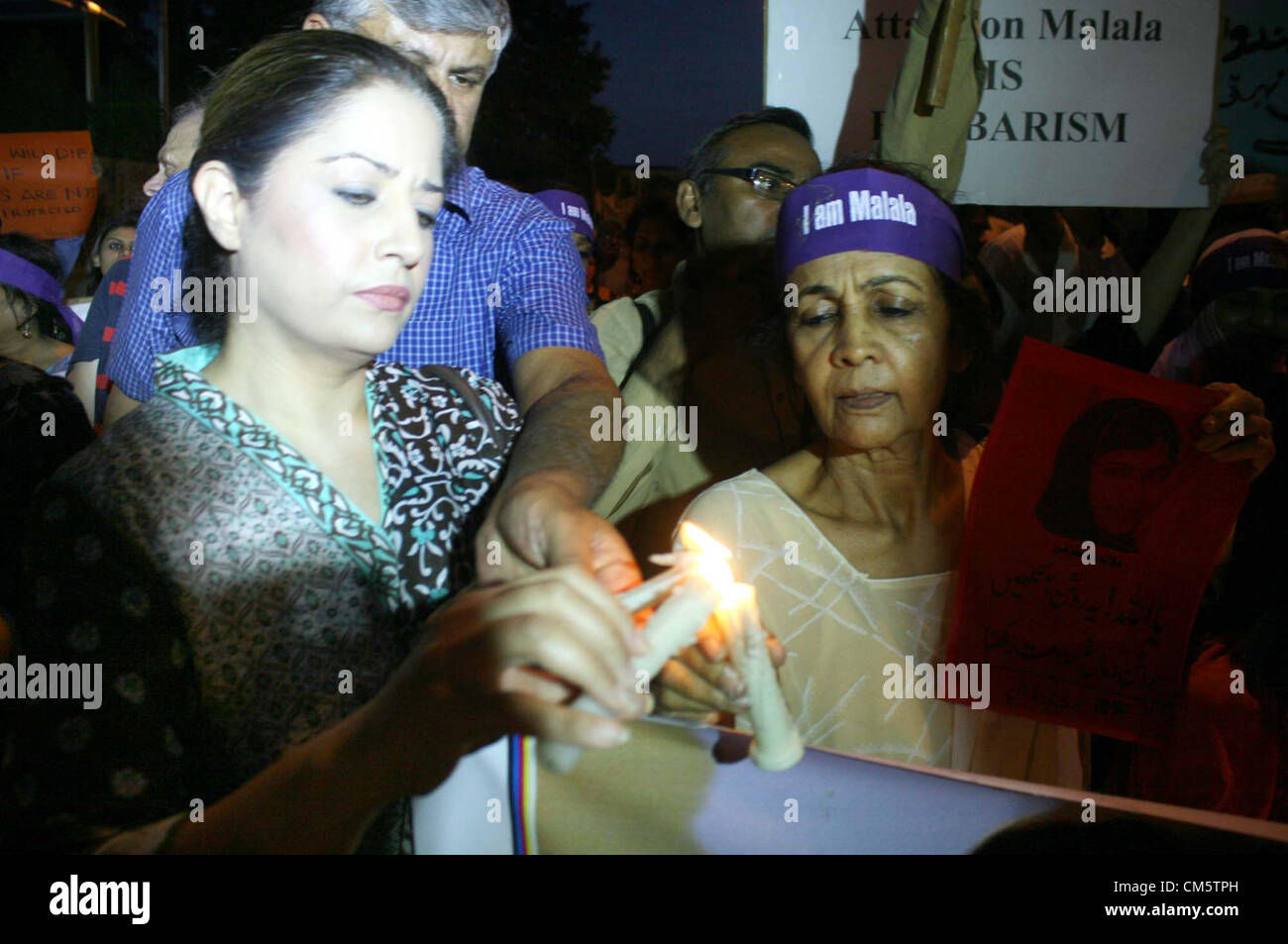 Members of Aurat Foundation lighten candles and praying for Malala ...