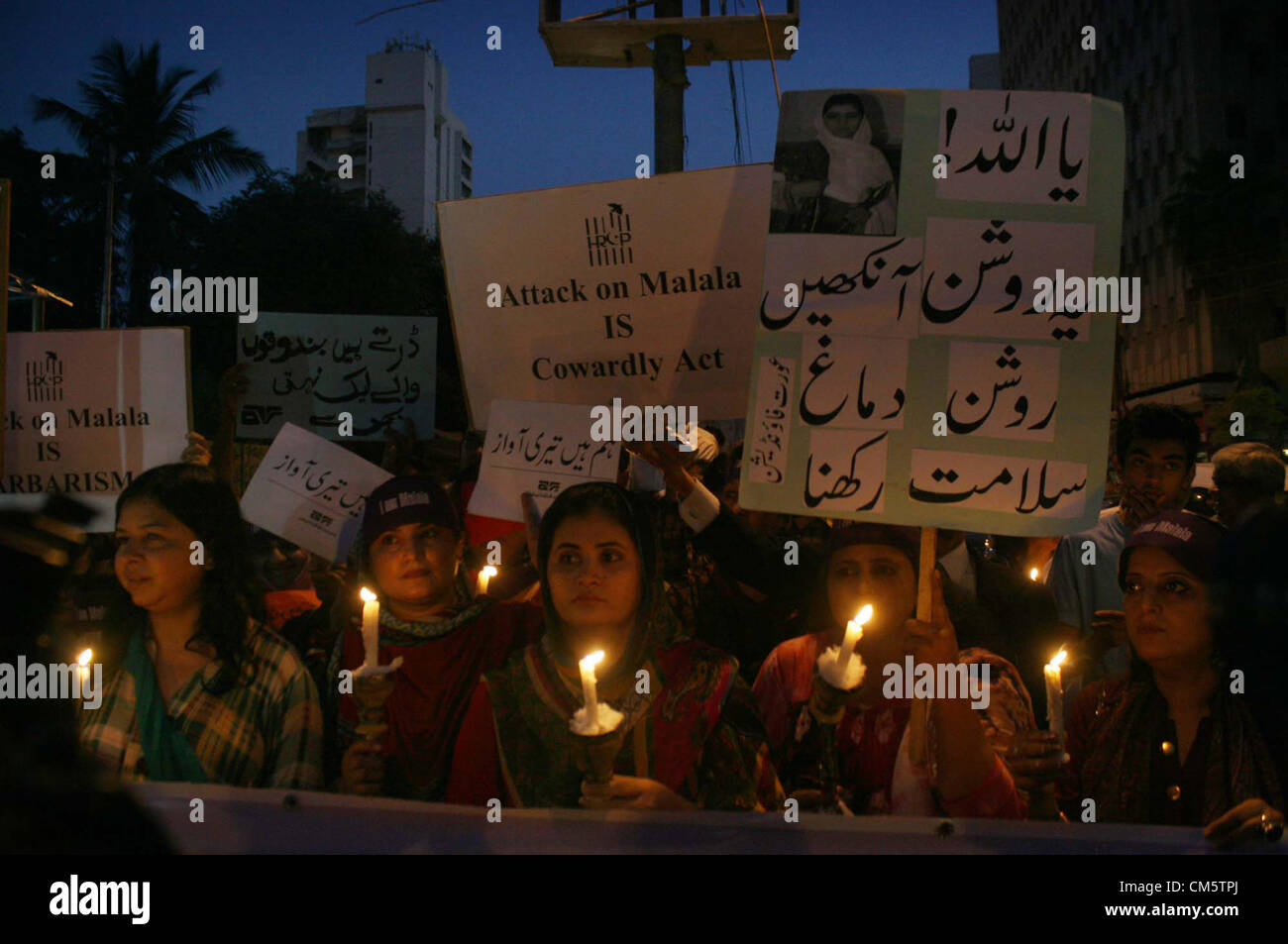 Members of Aurat Foundation lighten candles and praying for Malala ...