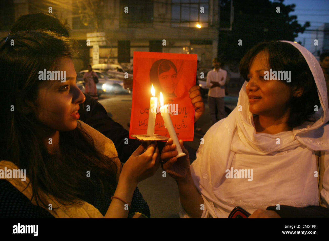Members of Aurat Foundation lighten candles and praying for Malala ...