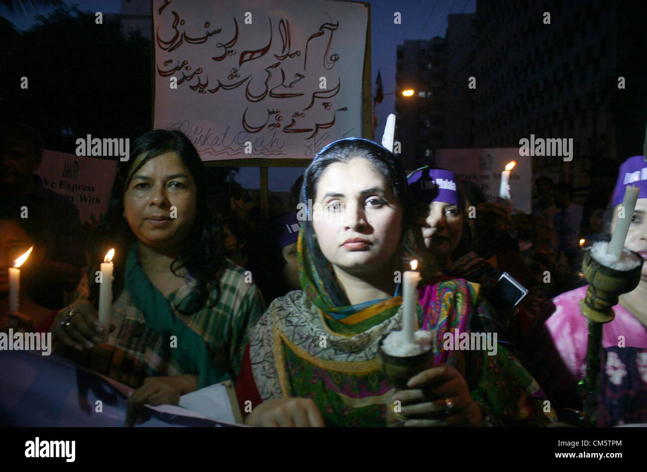 Members of Aurat Foundation lighten candles and praying for Malala ...