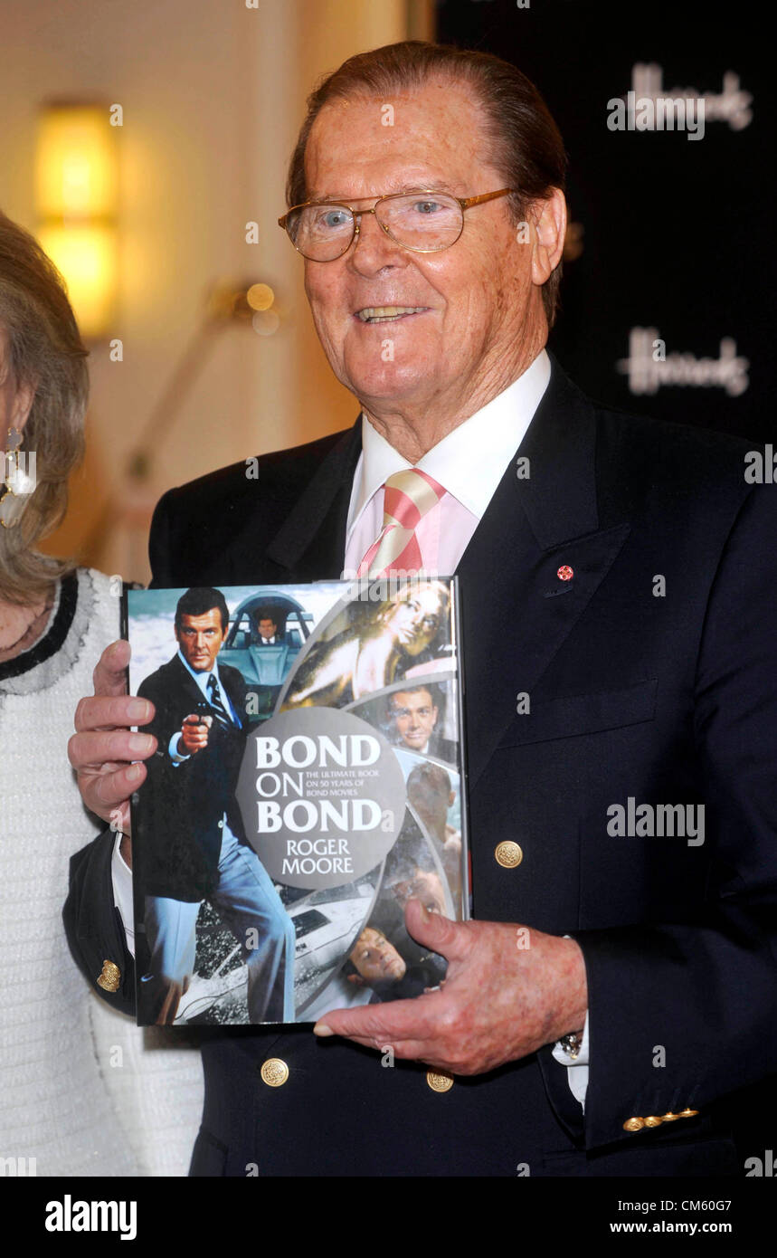Sir Roger Moore signing copies of his book 'Bond on Bond' at Harrods ...