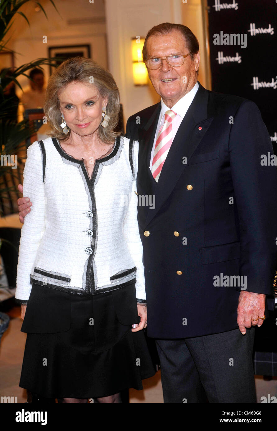 Sir Roger Moore signing copies of his book 'Bond on Bond' at Harrods ...