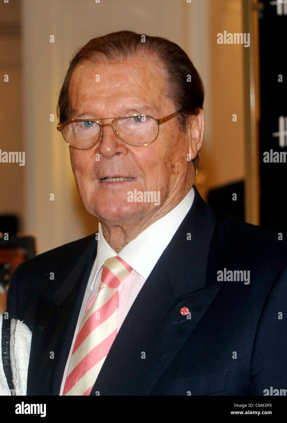 Sir Roger Moore signs copies of his new book 'Bond On Bond' at Harrods ...