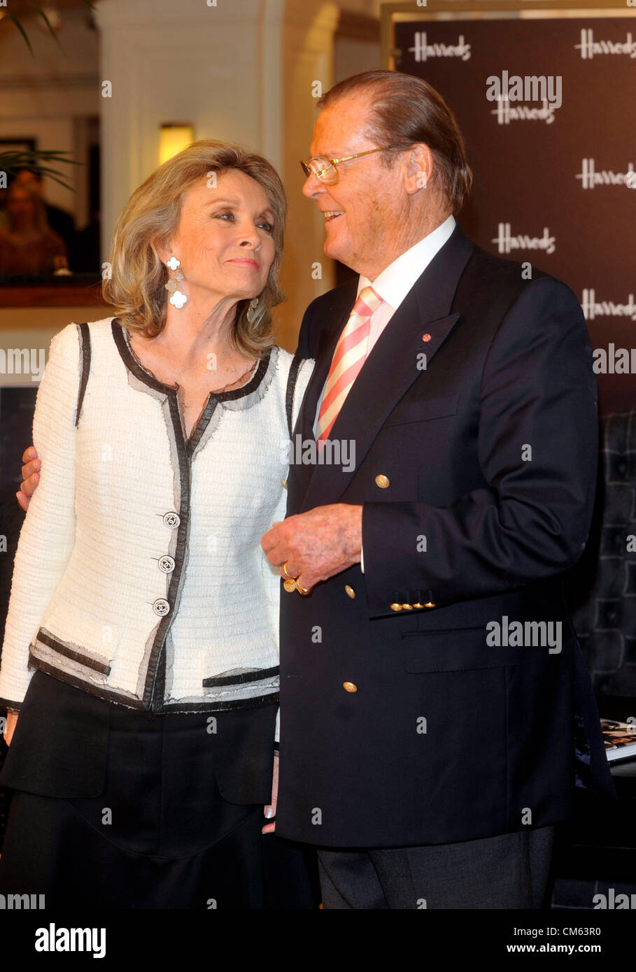 Sir Roger Moore signs copies of his new book 'Bond On Bond' at Harrods ...