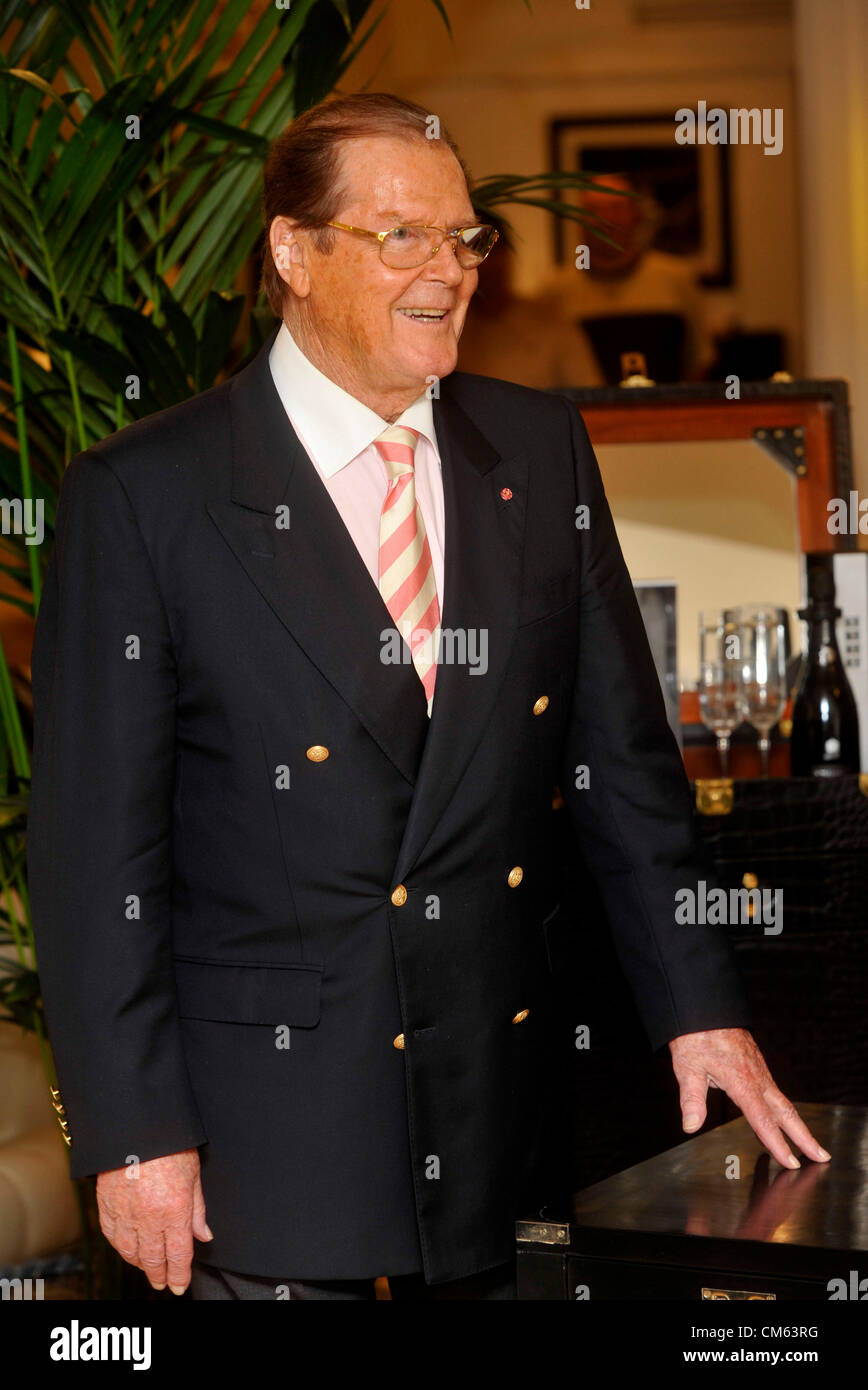 Sir Roger Moore signs copies of his new book 'Bond On Bond' at Harrods ...