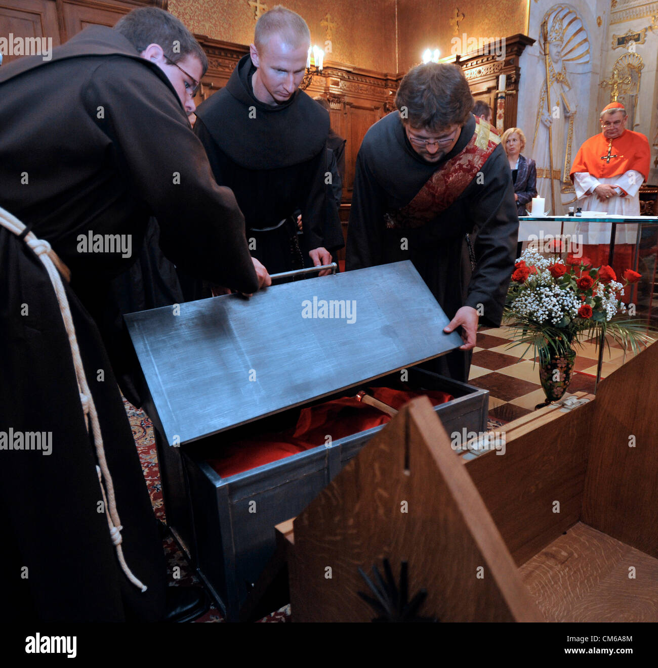 Leaden box with relics of fourteen Franciscan friars pictured in Prague ...