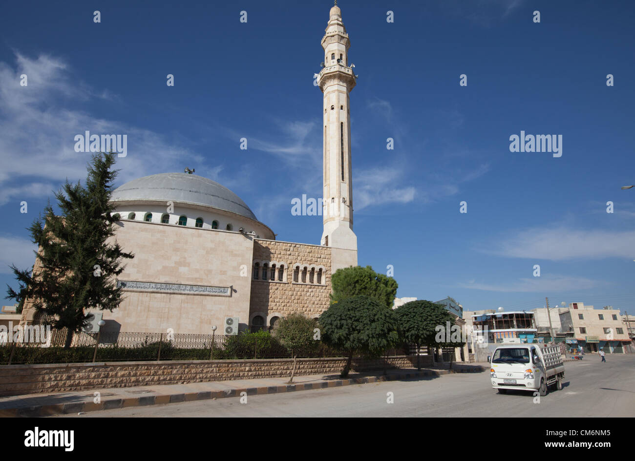 Azaz, Syria. 17th October 2012. A truck passes by an undamaged mosque ...