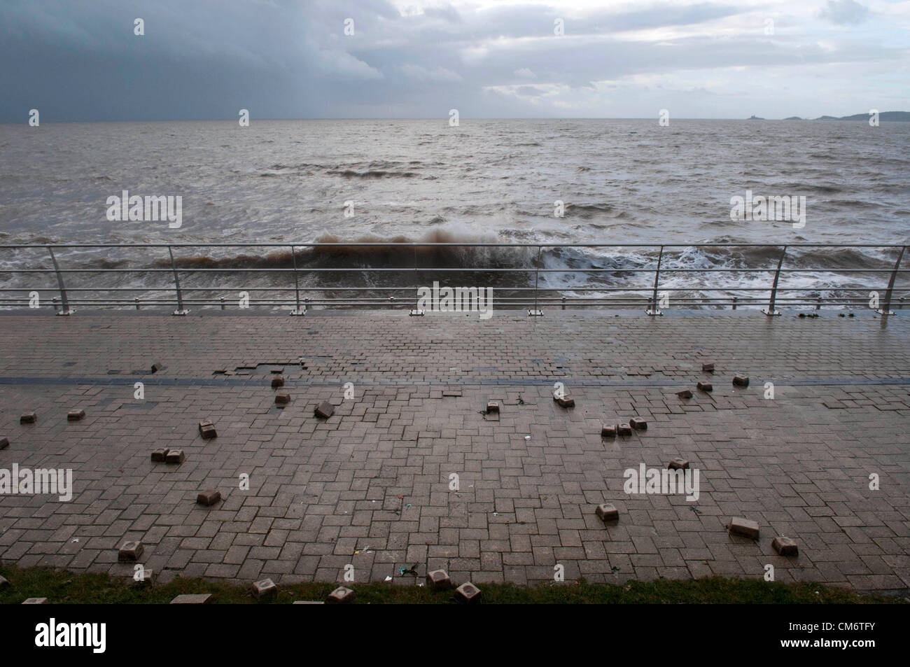 Rough seas / Swansea / UK / 18th October 2012 : Paving slabs ripped up ...