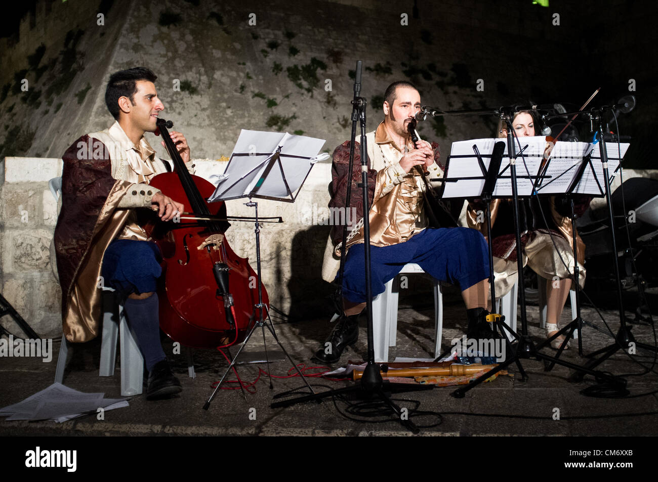A Baroque Music group performs beneath the King David Tower entrance at ...