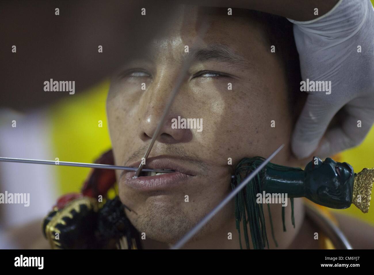 Oct. 19, 2012 - Phuket, Thailand - Devotees to the Chinese shrine of ...