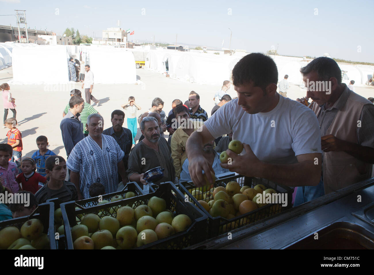 Azaz, Syria. 19th October 2012. People line up for food distribution at ...