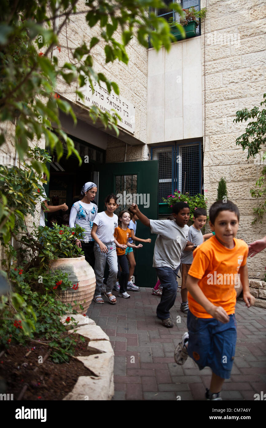 Children hastily evacuate the Frenkel School as part of Turning Point 6 ...