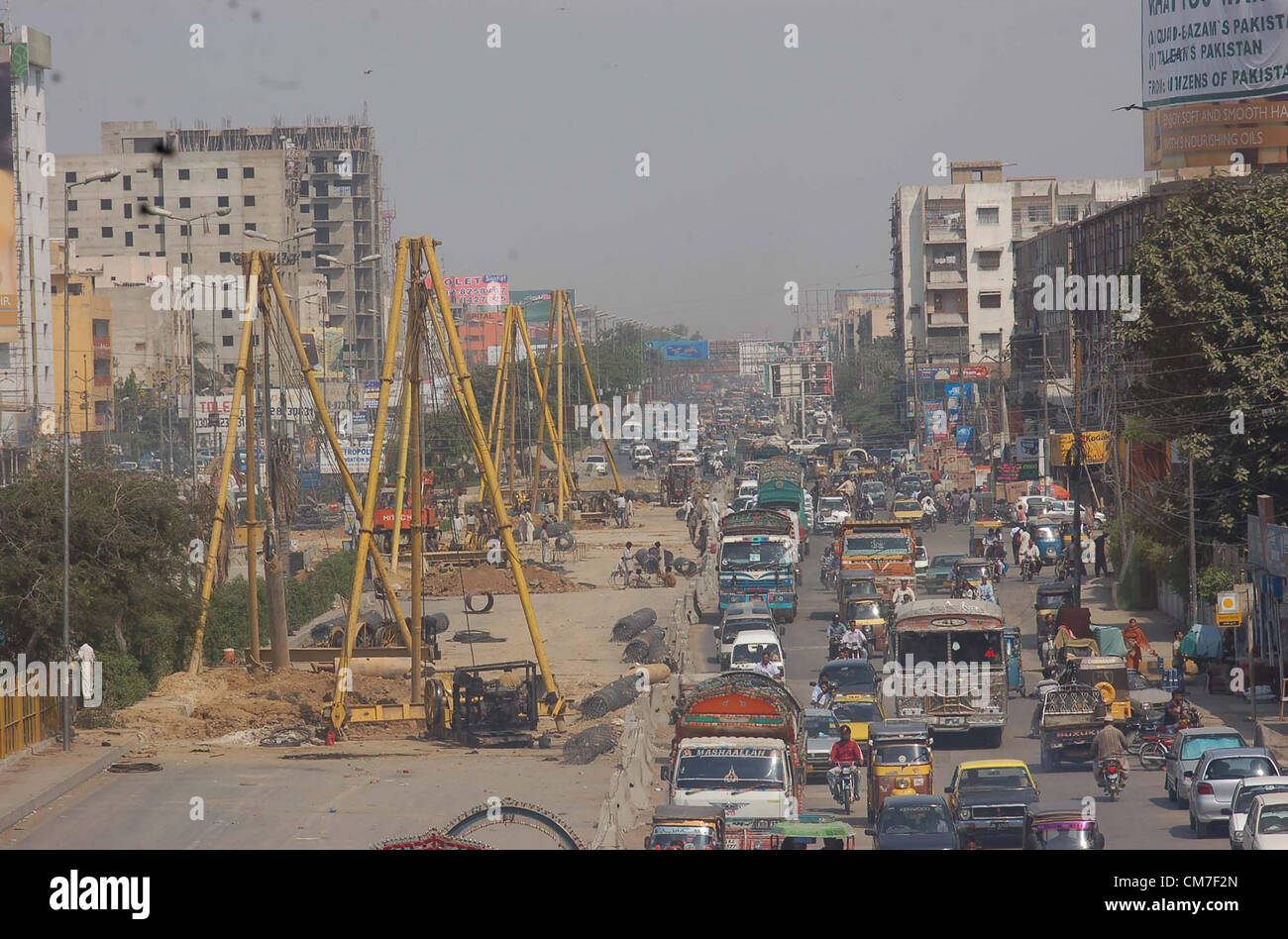 A view of construction work of a flyover in progress at Shahrah-e ...