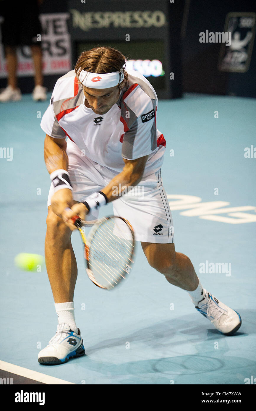 24.10.2012 Valencia, Spain. David Ferrer of Spain plays a double handed ...